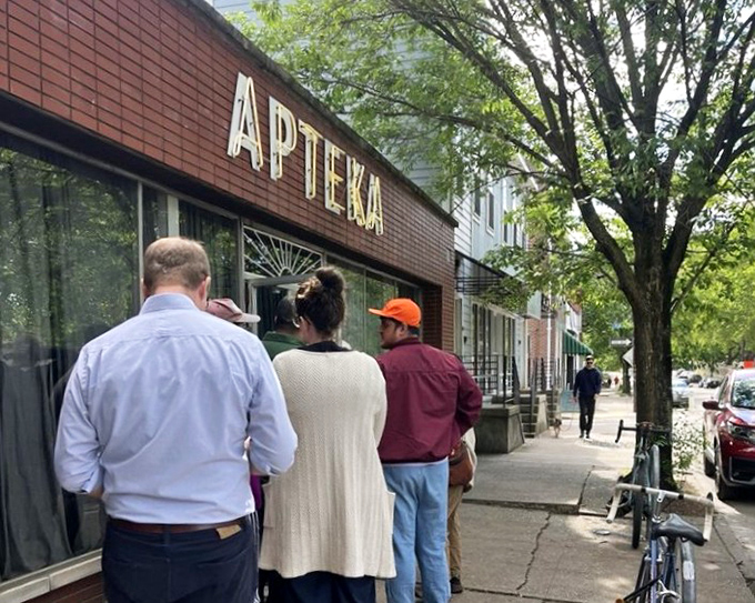 Apteka's brick facade stands proudly on a Pittsburgh street, where locals line up for plant-based Polish magic that would make their babcias proud.