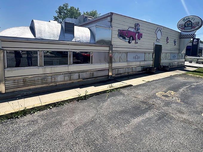 The classic stainless steel exterior of Nancy's Main Street Diner gleams like a time machine to the golden age of American roadside dining.