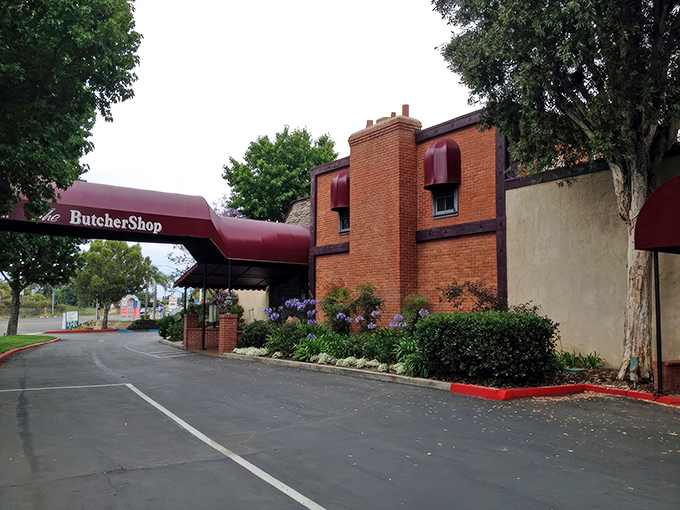 The brick fa&ccedil;ade and burgundy awning of The Butcher Shop stand ready to welcome hungry patrons. Like a carnivore's lighthouse beckoning you to safe harbor.