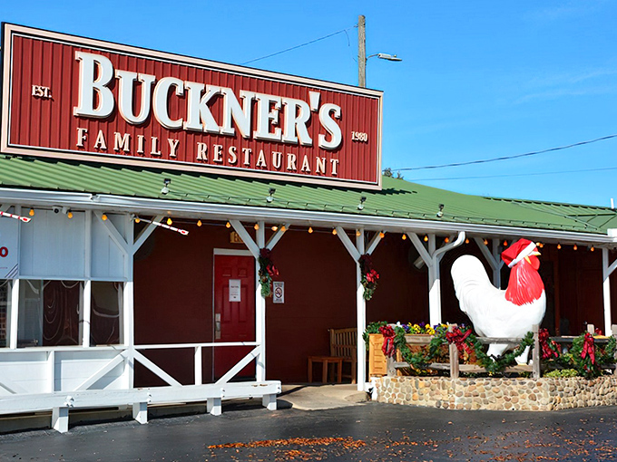 The red barn exterior with its giant rooster sentinel isn't just a restaurant&mdash;it's a Southern food embassy where calories don't count and diet plans go to die.