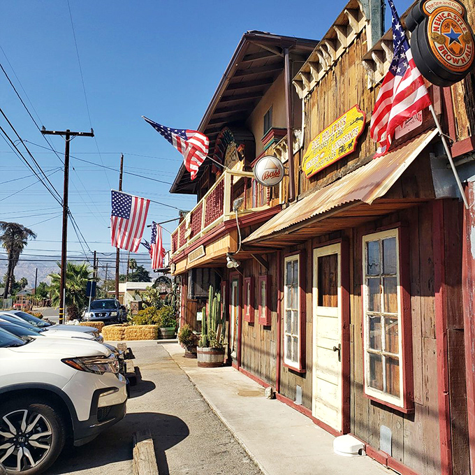 The wooden fa&ccedil;ade of Mill Creek Cattle Company looks like it was plucked straight from a John Wayne movie set, complete with hay bales and American flags.