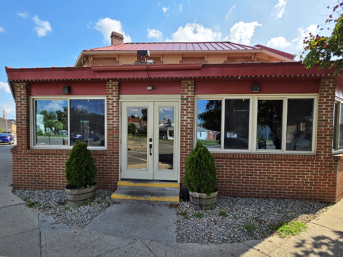 The unassuming brick exterior of Old Canal Smoke House in Chillicothe &ndash; where barbecue dreams are hiding behind modest doors.