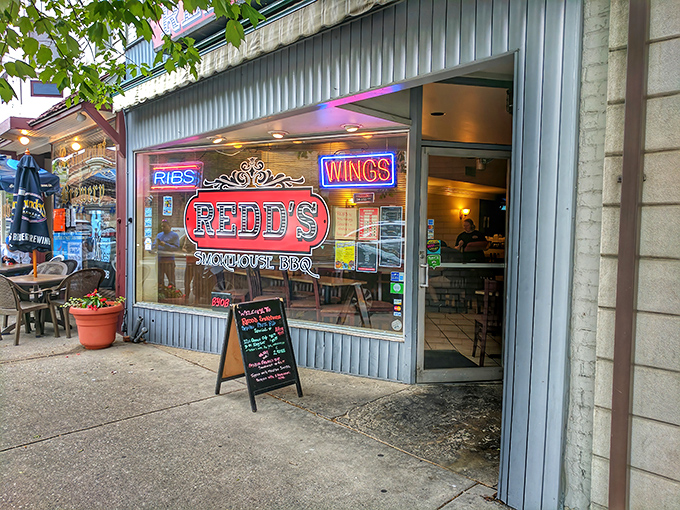 That bold red sign against the blue-gray exterior is like a beacon calling to hungry travelers. BBQ paradise awaits inside!
