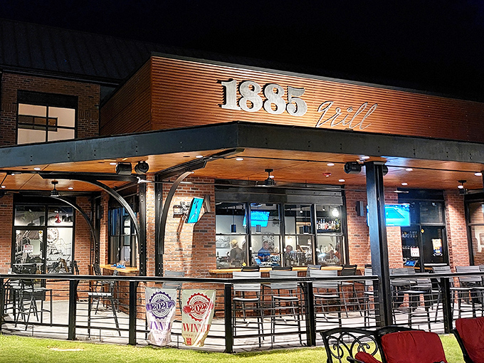 The warm glow of 1885 Grill's exterior beckons like a lighthouse for hungry souls navigating the sea of mediocre dining options.