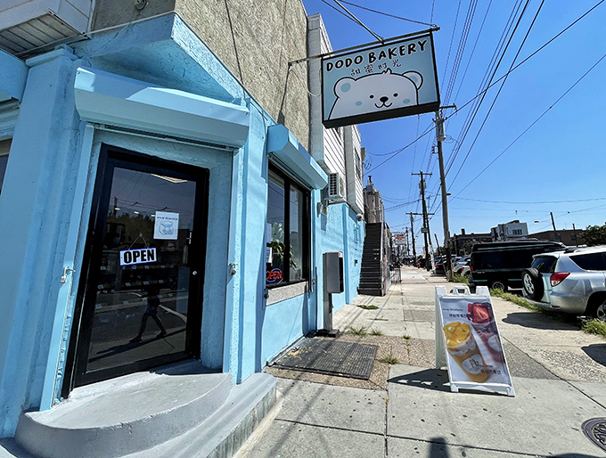 The cheerful blue exterior of Dodo Bakery stands out like a dessert oasis in Philadelphia, complete with that adorable polar bear mascot beckoning you inside.