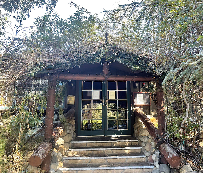 The entrance to Saddle Peak Lodge looks like the secret portal to Narnia's most delicious restaurant. Stone steps and rustic timber beckon adventurous diners.