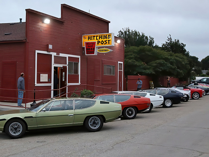The iconic red exterior of The Hitching Post stands like a beacon for steak lovers, with vintage cars often lining the parking lot—a time capsule of California culinary history.