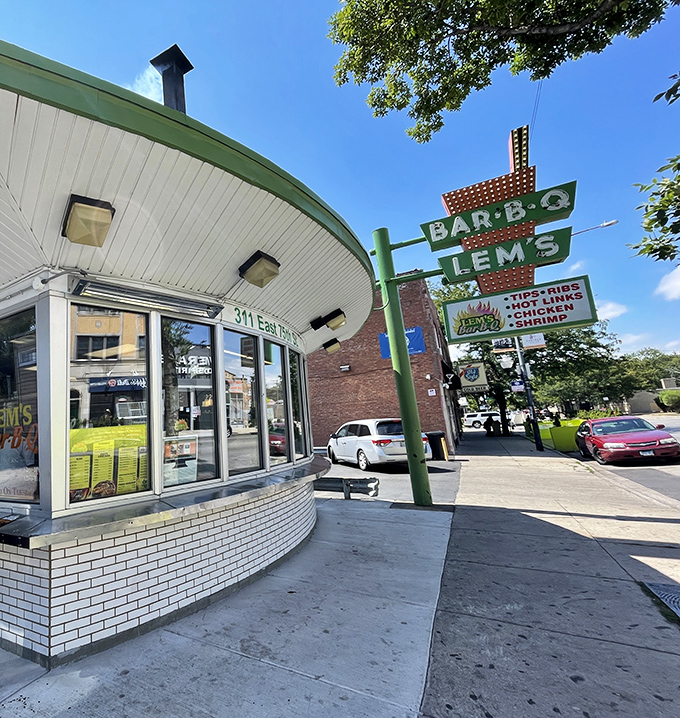 The iconic green and red sign of Lem's Bar-B-Q stands like a beacon of hope for hungry Chicagoans, promising smoky salvation from a humble storefront.