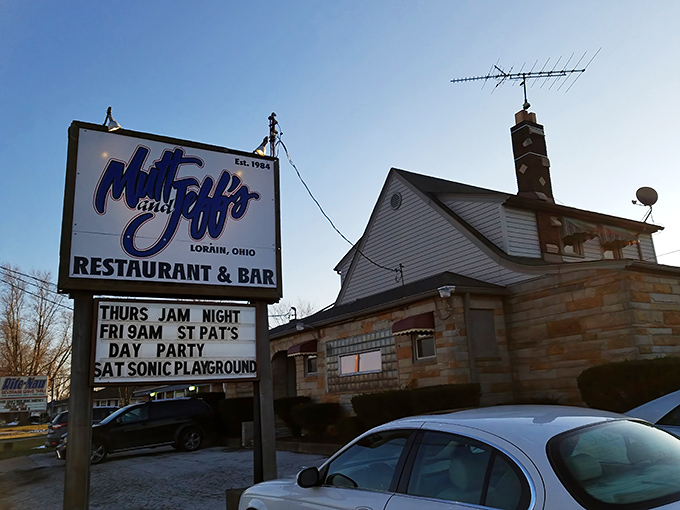 The iconic blue and white sign of Mutt & Jeff's stands tall against the Ohio sky, a beacon for hungry travelers seeking burger nirvana.