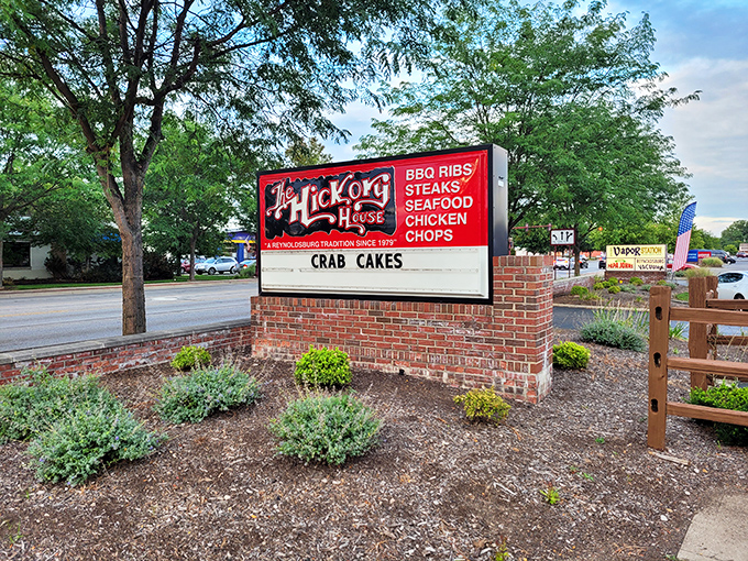 The roadside sign beckons like a meaty lighthouse, promising BBQ ribs and steaks that'll make your cardiologist wince but your taste buds dance with joy.