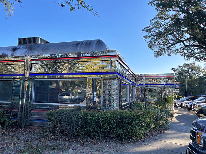 The gleaming chrome exterior of Scenic 90 Cafe shines like a beacon of nostalgia under the Florida sun, promising comfort food treasures within.