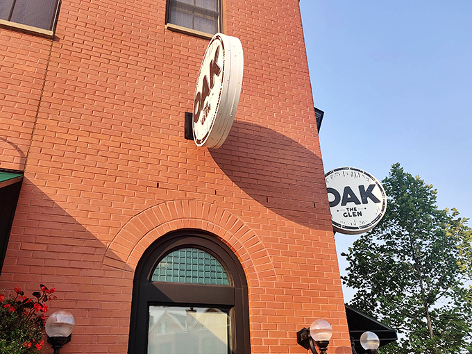 The iconic Oak sign beckons from the warm brick facade, promising culinary adventures that have burger enthusiasts making pilgrimages from across Illinois.