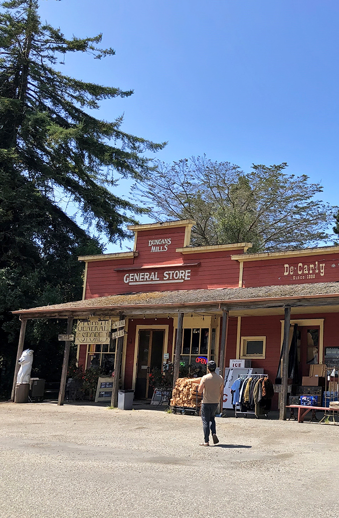 The red clapboard exterior of Duncans Mills General Store stands like a time capsule from California's past, beckoning hungry travelers with promises of sandwich perfection.