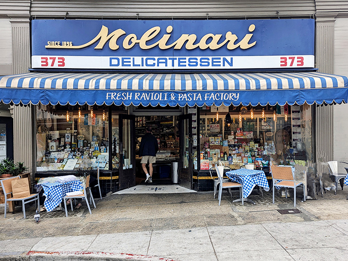 The iconic blue and white awning of Molinari's stands as a beacon of sandwich salvation in North Beach, promising Italian delights that transcend time.
