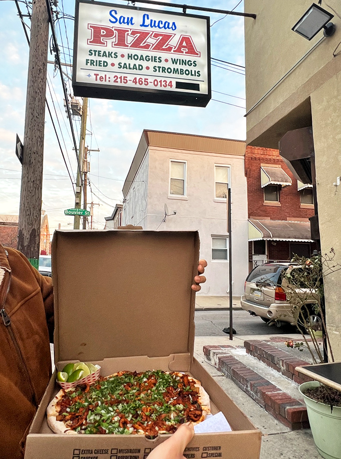 The iconic San Lucas Pizza sign beckons hungry Philadelphians like a lighthouse for the stomach-starved. Simple, straightforward, and promising delicious salvation.