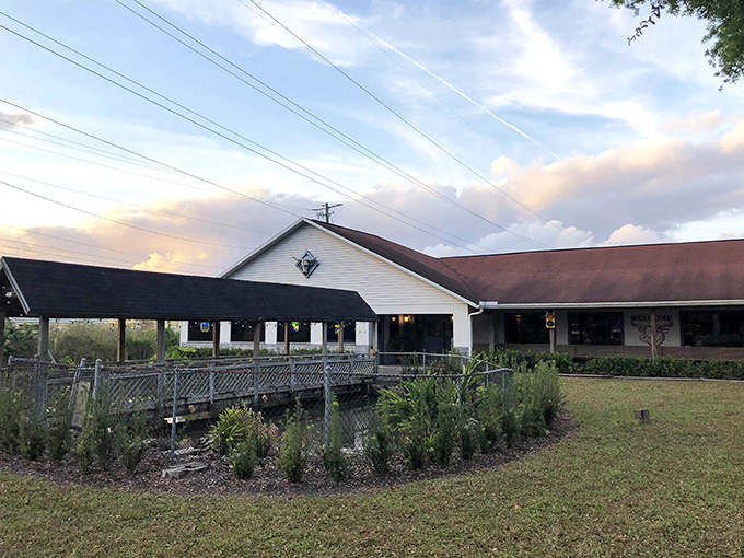 The unassuming exterior of Frontier Steakhouse boldly announces its "6 Pound Challenge" like a carnivore's Everest waiting to be conquered. Pure Florida steakhouse confidence.