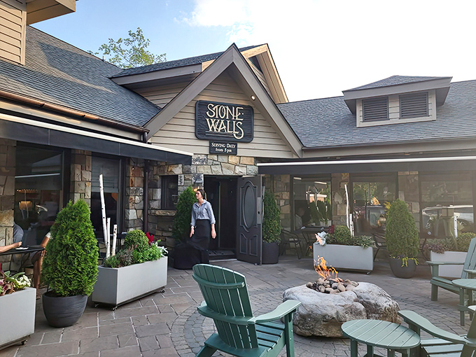 The entrance beckons with Adirondack chairs and a crackling fire pit&mdash;nature's perfect waiting room for what lies beyond those wooden doors.
