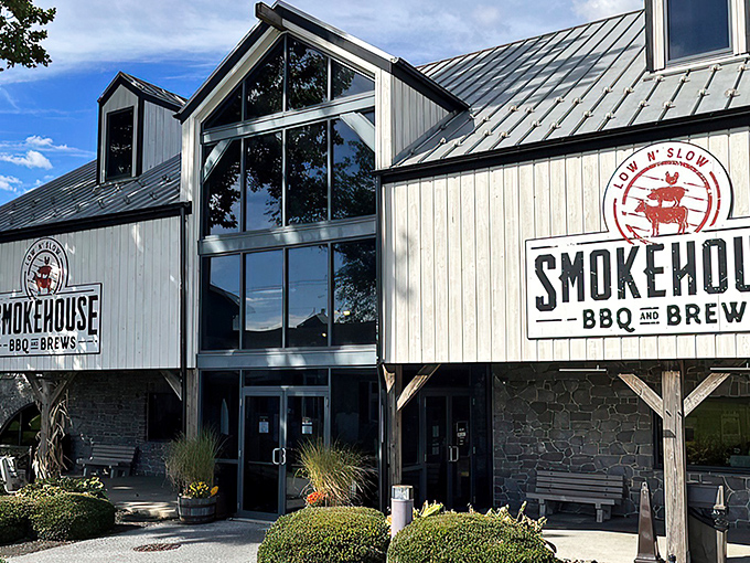 The gleaming metal roof and rustic-modern exterior of Smokehouse BBQ & Brews stands as a beacon of hope for hungry travelers in Amish Country.