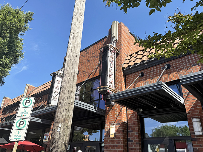 The brick fa&ccedil;ade of Cadillac Caf&eacute; stands as Portland's breakfast beacon, promising culinary delights behind its unassuming exterior.