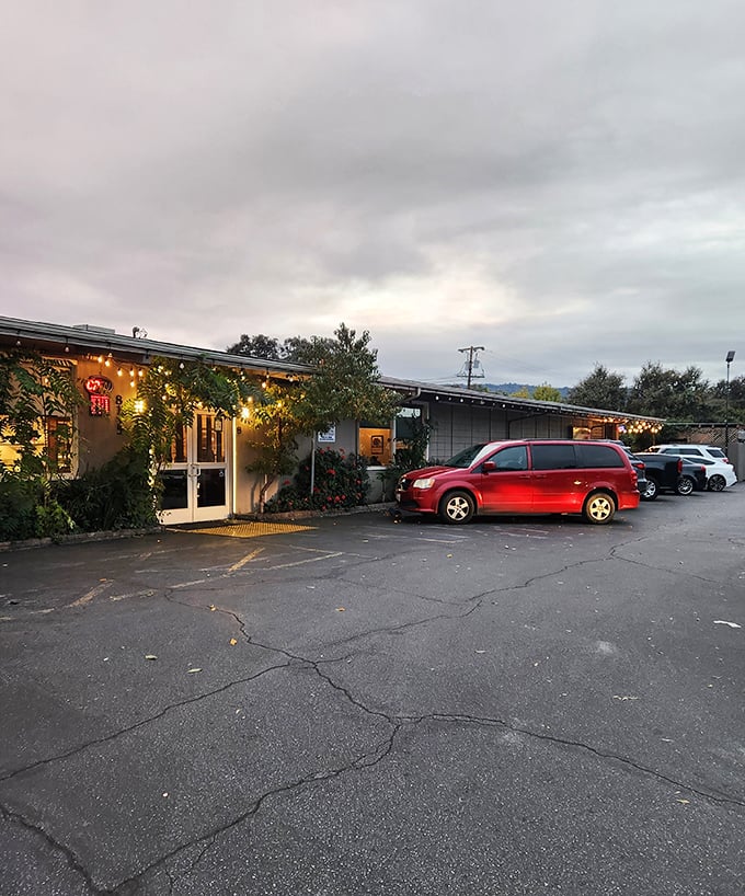 The unassuming exterior of Longhouse Restaurant in Gilroy hides culinary treasures within. String lights add a welcoming touch to this local gem.