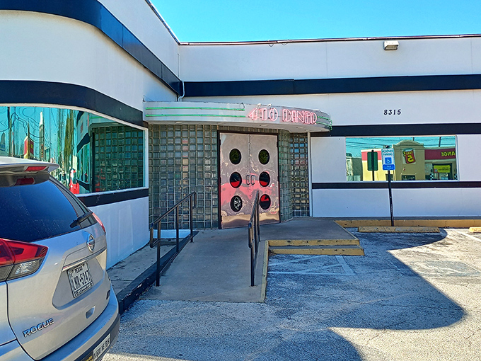 The iconic porthole doors of 410 Diner beckon like a time machine to the golden age of American roadside dining.