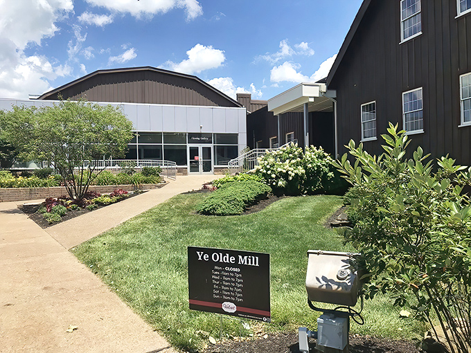 The historic black-and-white buildings of Ye Olde Mill welcome visitors with manicured landscaping and a promise of sweet memories to come.