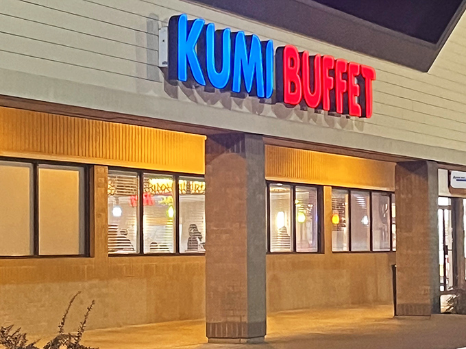 The blue and red sign beckons like a lighthouse for hungry souls. Kumi Buffet's modest exterior hides culinary treasures within.