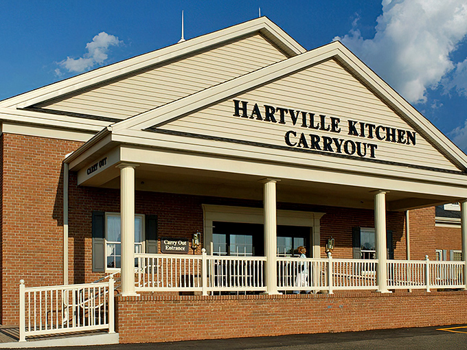 That classic brick facade with white columns whispers "serious comfort food lives here, folks."