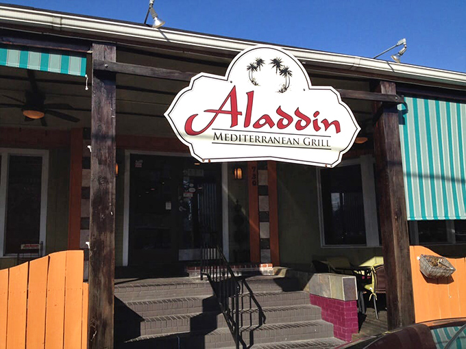 The teal-striped awnings and vibrant orange accents of Aladdin's exterior aren't just eye-catching&mdash;they're practically sending smoke signals to hungry passersby: "Mediterranean magic happens here!"