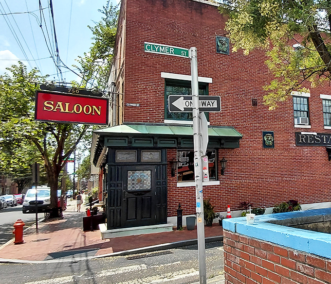 The Saloon's classic white brick exterior with its distinctive green trim feels like stepping into Philadelphia's storied past, where culinary treasures await behind that unassuming door.