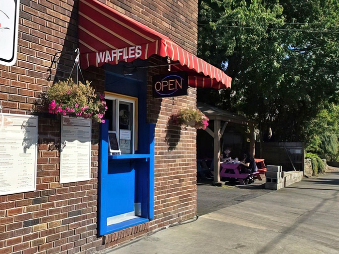 The iconic blue window where waffle dreams come true. Portland's beloved breakfast spot proves sometimes the best things come from the smallest openings.