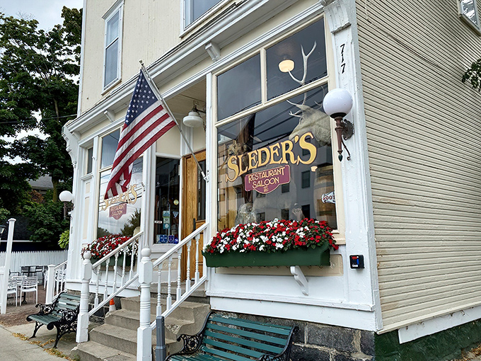The white clapboard exterior of Sleder's stands like a time capsule in Traverse City's Slabtown neighborhood. Those green benches have witnessed countless post-meal conversations.
