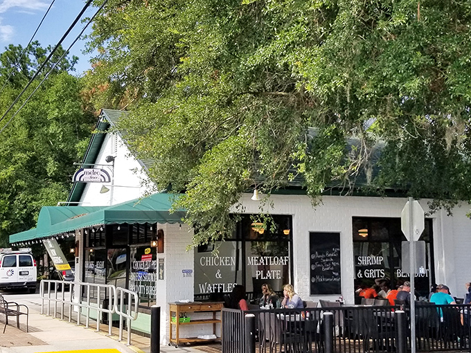 Metro Diner's iconic green awning beckons from Hendricks Avenue like a culinary lighthouse guiding hungry souls to breakfast paradise.