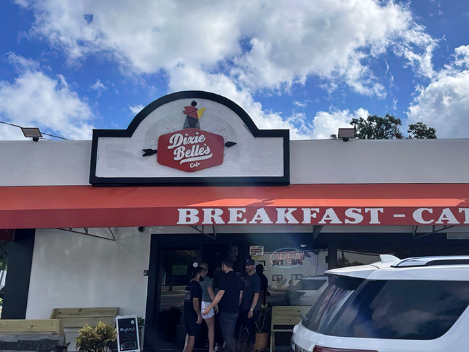 The iconic Dixie Belle's Cafe storefront beckons with its cheerful red awning and promise of breakfast bliss. Like finding a $20 bill in your winter coat pocket &ndash; unexpected joy awaits.