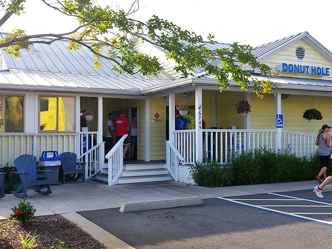 The cheerful yellow exterior of Donut Hole beckons like a sunny promise of comfort food to come. Blue Adirondack chairs invite lingering conversations.