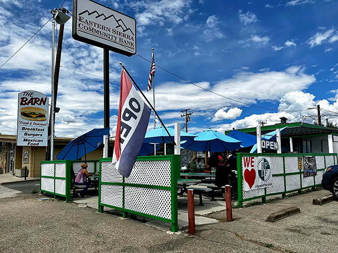 The Barn's cheerful green trim and blue umbrellas stand out against the Eastern Sierra sky like a mirage for hungry travelers on Highway 395.