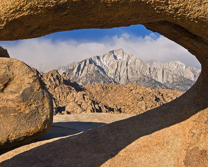 Nature's own sculpture garden where golden rocks create narrow passages that feel like walking through an artist's imagination.