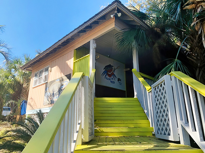 The bright yellow stairs welcome you like a sunbeam, promising seafood treasures at the end of your ascent.