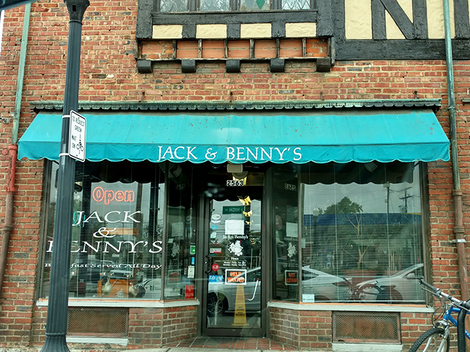 The iconic teal awning of Jack & Benny's beckons hungry patrons like a breakfast lighthouse guiding ships through morning hunger pangs.