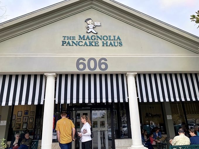 The iconic facade of Magnolia Pancake Haus beckons with its classic columns and cheerful chef logo—breakfast paradise found in San Antonio.