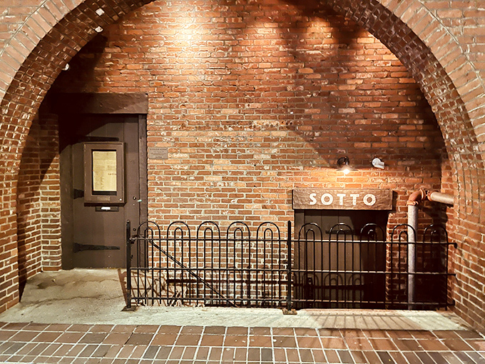 The unassuming entrance to Sotto feels like discovering a secret passageway to Italy. This brick-framed doorway marks the beginning of your underground culinary adventure.