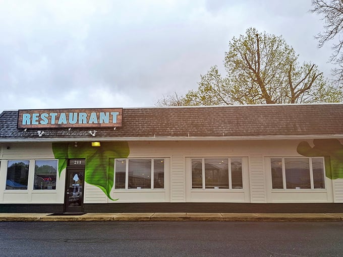 The vibrant green exterior with delicate flower murals makes The Backyard impossible to miss, like a culinary oasis in Milton's landscape.