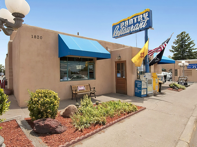 The iconic blue awning and vintage sign of The Pantry stand like a beacon of culinary hope on Cerrillos Road. Santa Fe's adobe charm meets comfort food paradise.