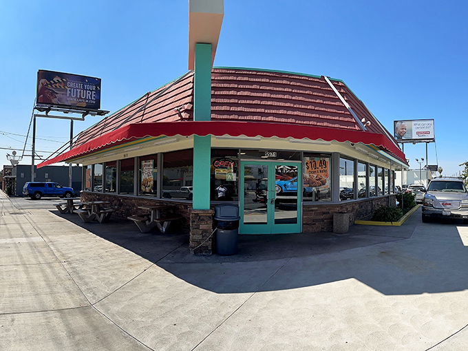 The iconic red roof and mint-green accents of Tom's Burgers 7 stand as a beacon of hope for hungry North Hollywood locals seeking breakfast salvation.