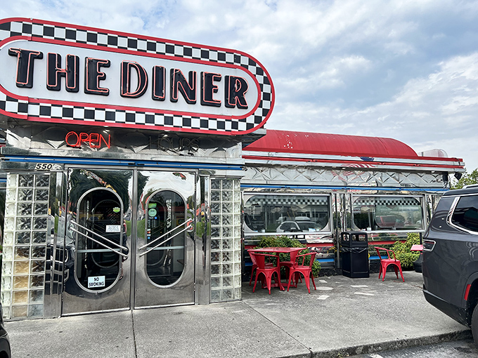 Chrome gleaming under Tennessee sunshine, The Diner's iconic red roof and checkerboard sign promise a time-traveling feast that delivers on nostalgia and flavor alike.