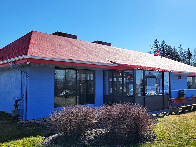 The classic blue-and-red exterior of Wilmington Diner stands like a beacon of breakfast hope on Marsh Road, promising comfort food salvation inside.
