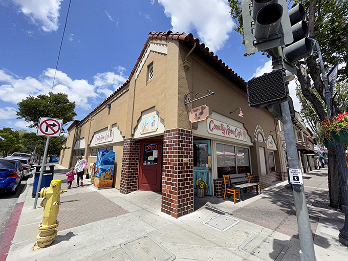The corner spot that launched a thousand breakfast pilgrimages. Country Rose Caf&eacute;'s Spanish-style exterior promises culinary treasures within.