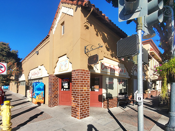 The Spanish-style architecture with its warm terra cotta roof and inviting brick entrance says "slow down and savor breakfast" before you even walk in.