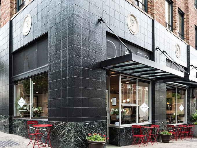 Classic "DINER" signage against dark green marble facade – Portland's culinary treasures often hide in plain sight, waiting for the hungry and curious.
