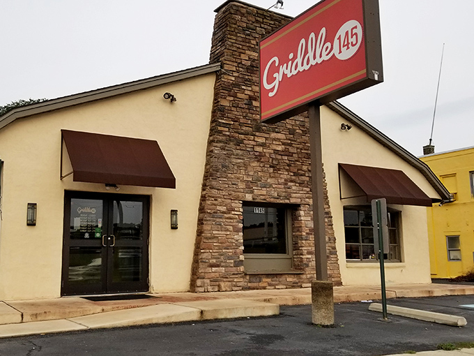 A stone-faced welcome that promises delicious secrets within. Griddle 145's humble exterior hides breakfast treasures that will haunt your dreams.